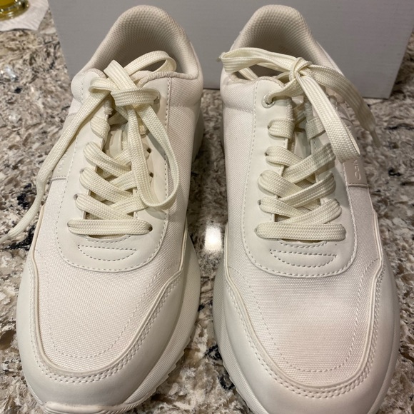 Calvin Klein | Shoes | Calvin Klein Cream Sneakers With Lowtop Design ...